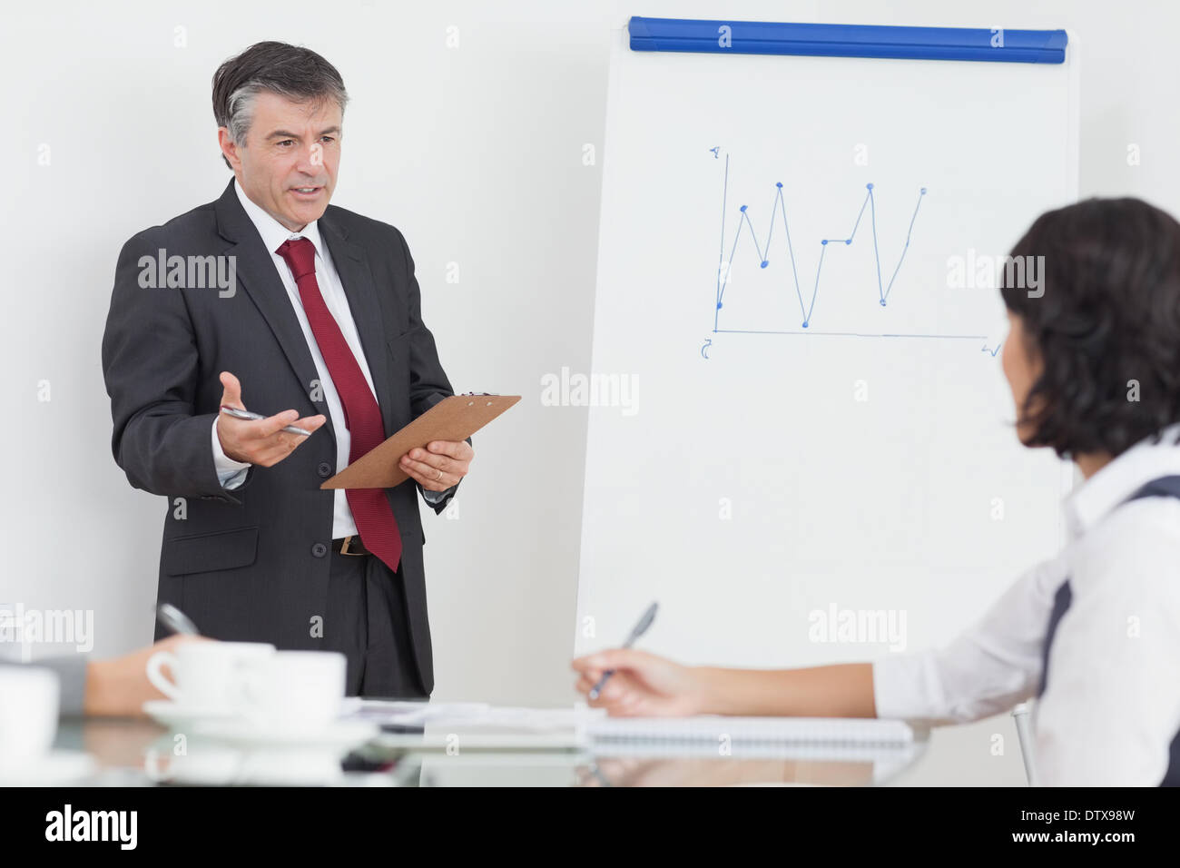Colleague explaining hi-res stock photography and images - Alamy