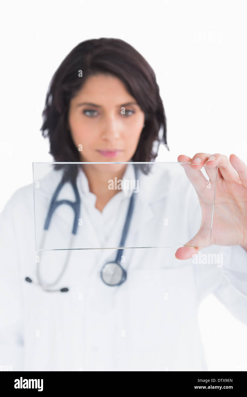 Doctor looking at virtual clear screen Stock Photo - Alamy