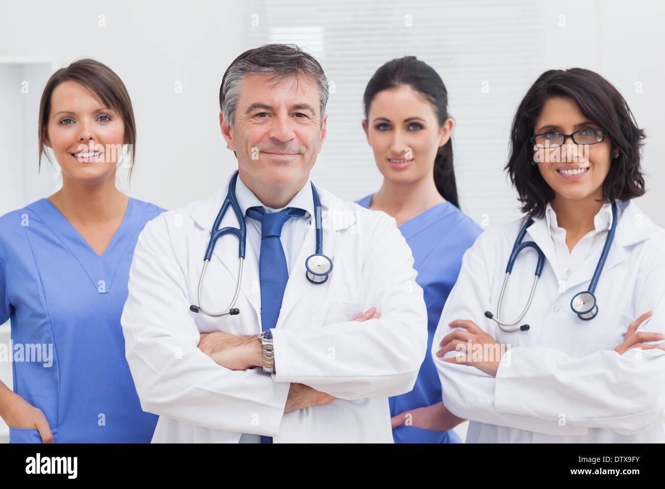 Two doctors and two nurses Stock Photo - Alamy