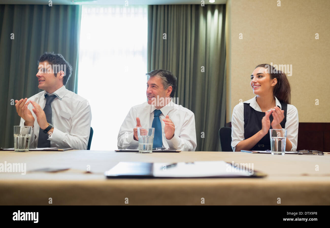 Business people clapping after meeting hi-res stock photography and ...