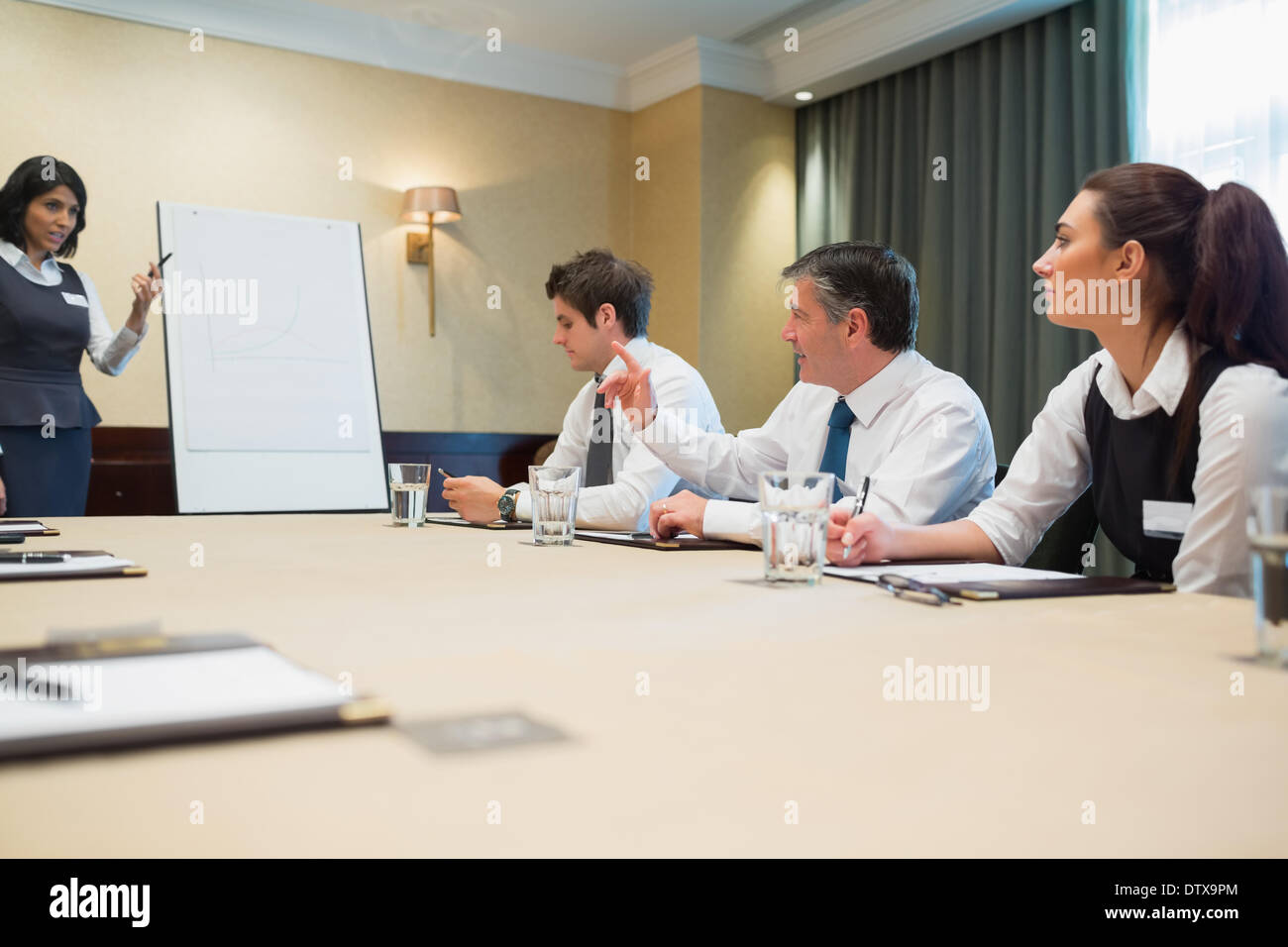 Businessman asking question at presentation Stock Photo - Alamy