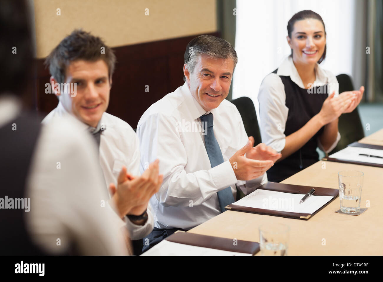 Business people clapping after a presentation Stock Photo - Alamy
