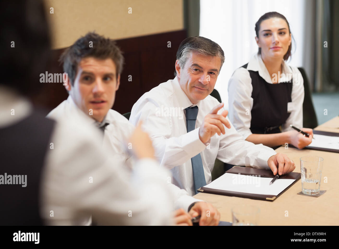 Man has question during business presentation Stock Photo - Alamy