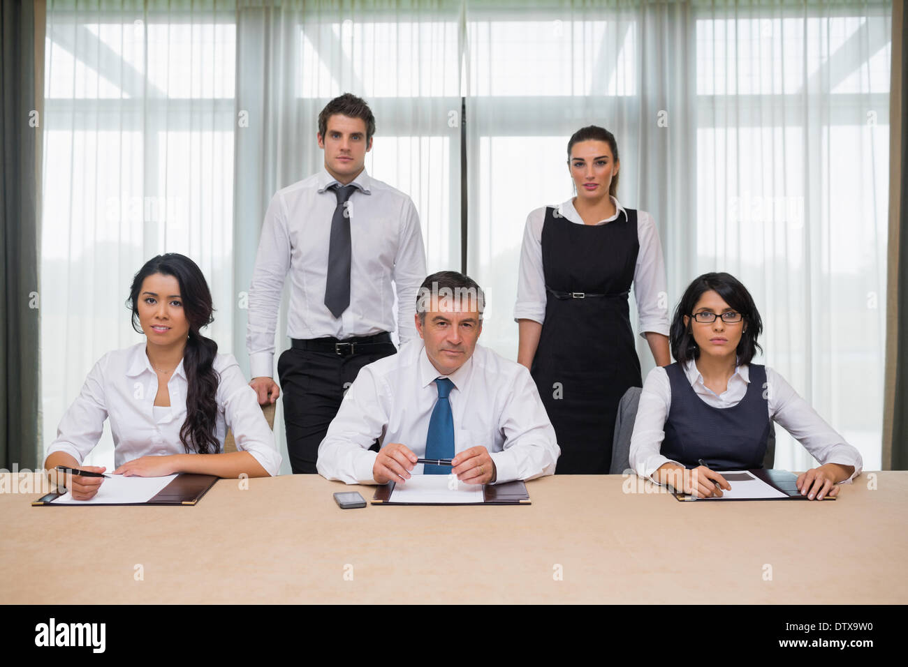 Serious business team Stock Photo - Alamy