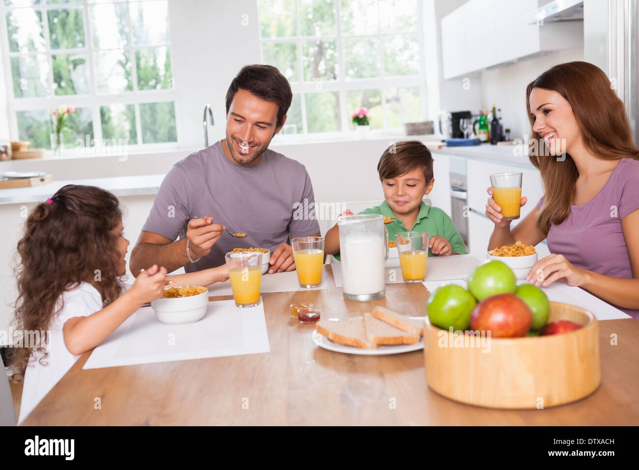Family eating healthy breakfast Stock Photo - Alamy