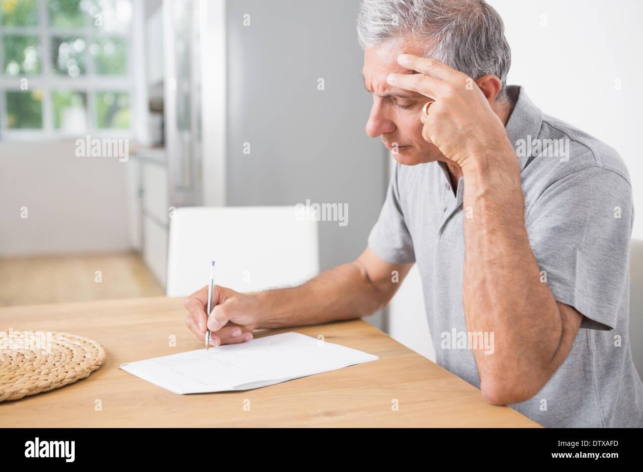 Thoughtful caucasian man reading documents hi-res stock photography and ...