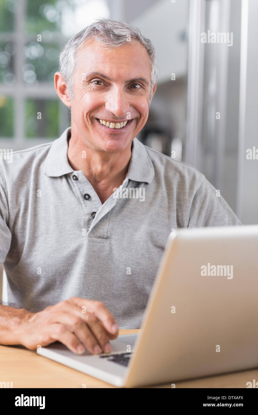 Man using his laptop Stock Photo - Alamy