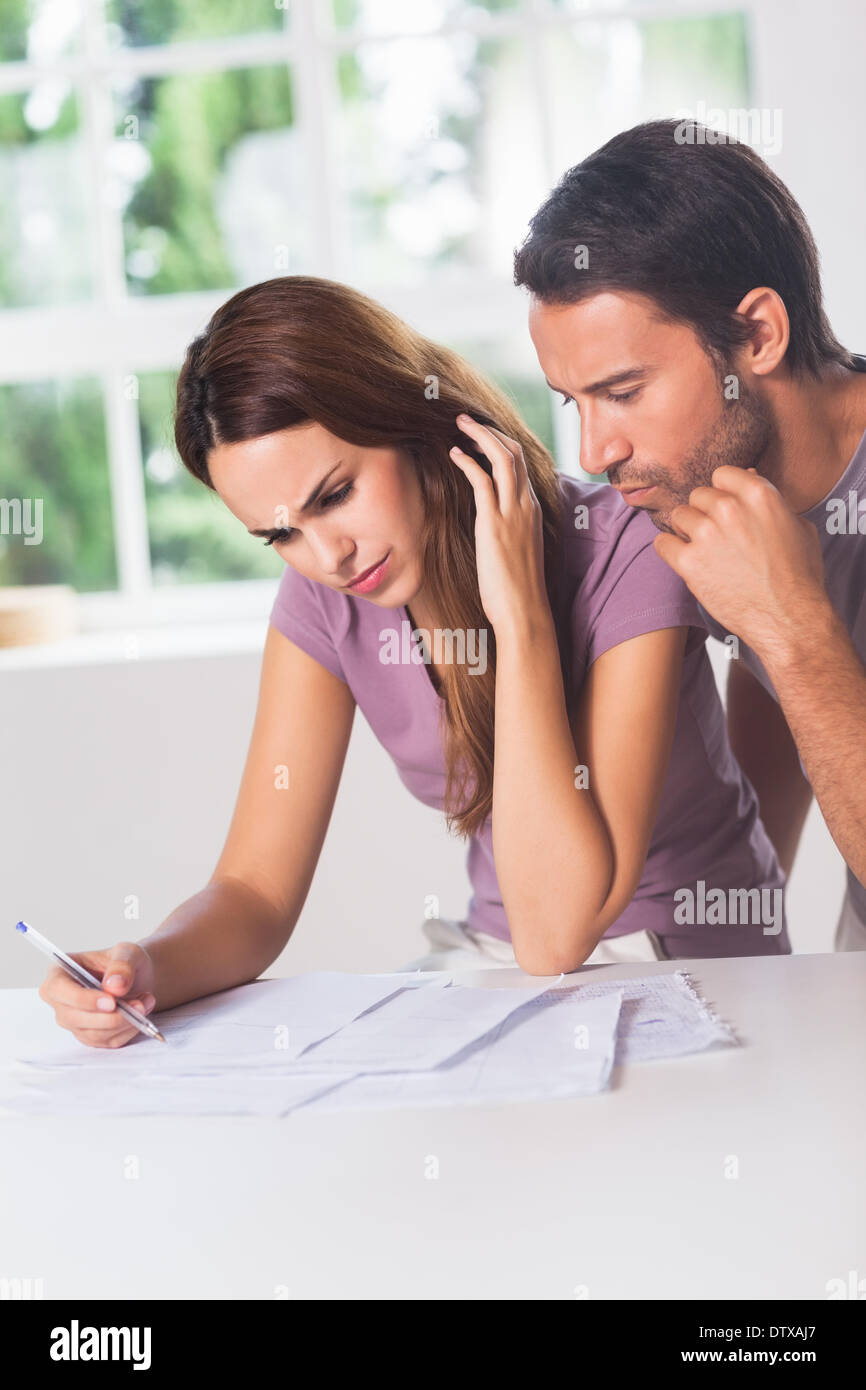 Couple doing their accounting Stock Photo - Alamy