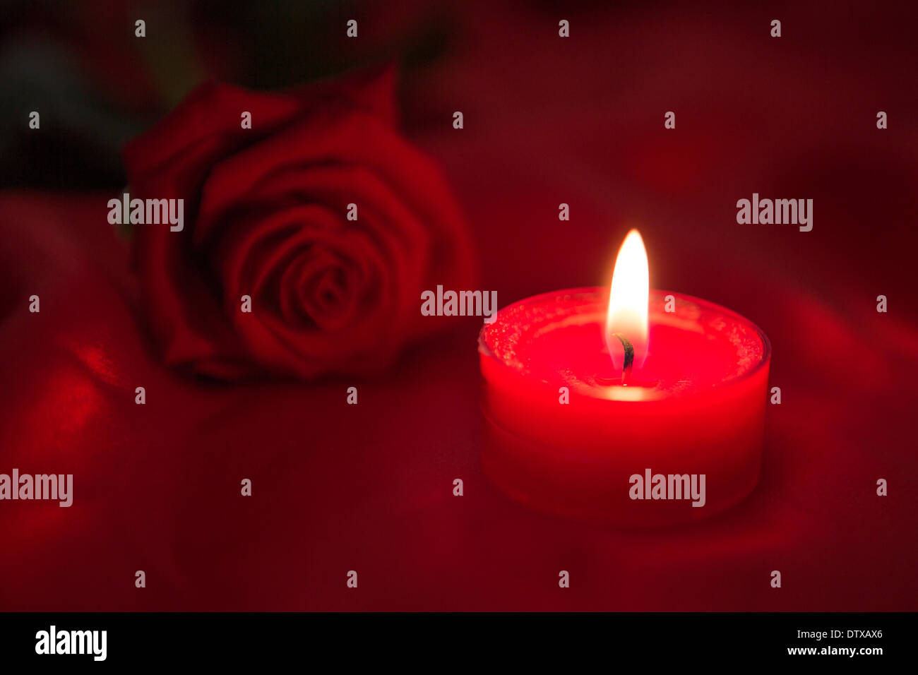Candle with red rose Stock Photo - Alamy