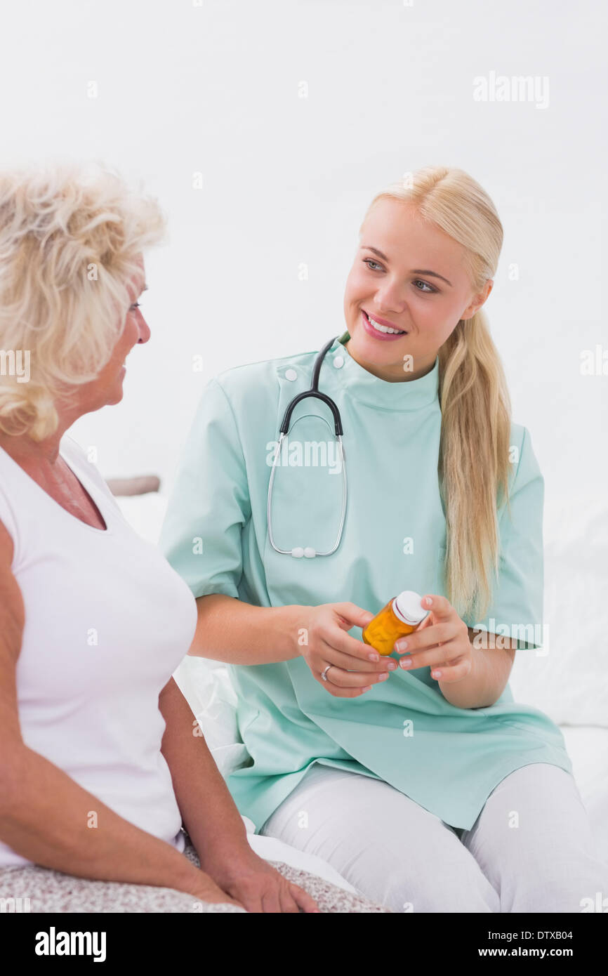 Nurse showing pills patient hi-res stock photography and images - Alamy