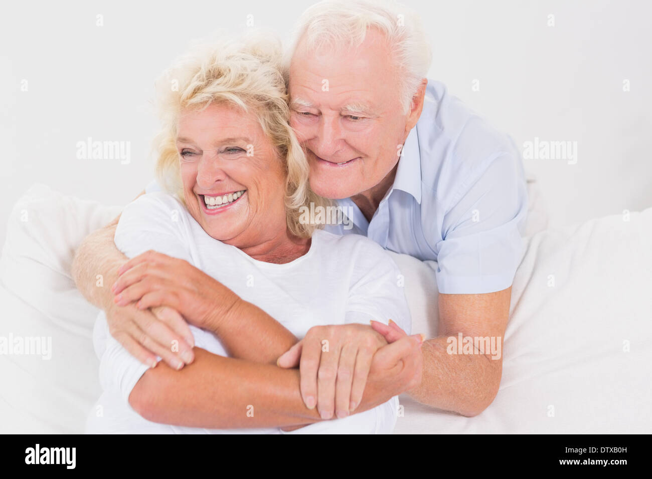 Old couple embracing Stock Photo - Alamy