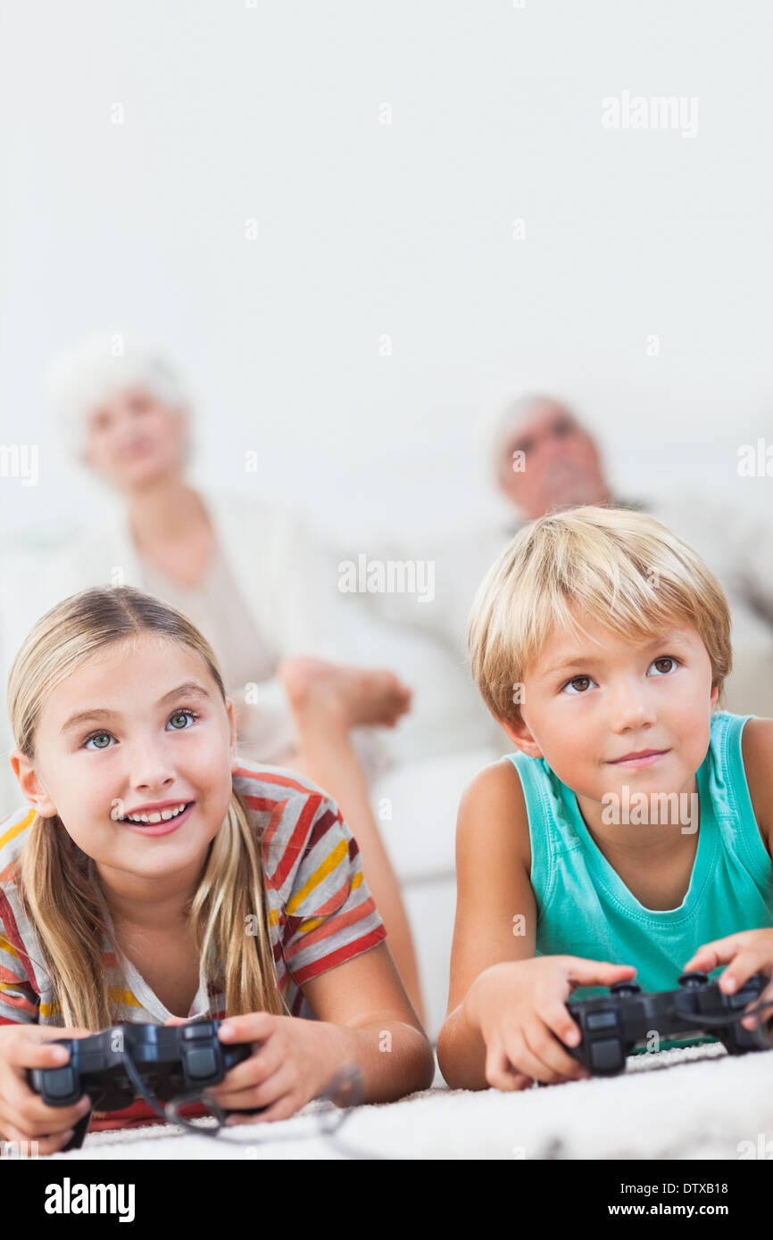 Brother and sister playing video games Stock Photo - Alamy