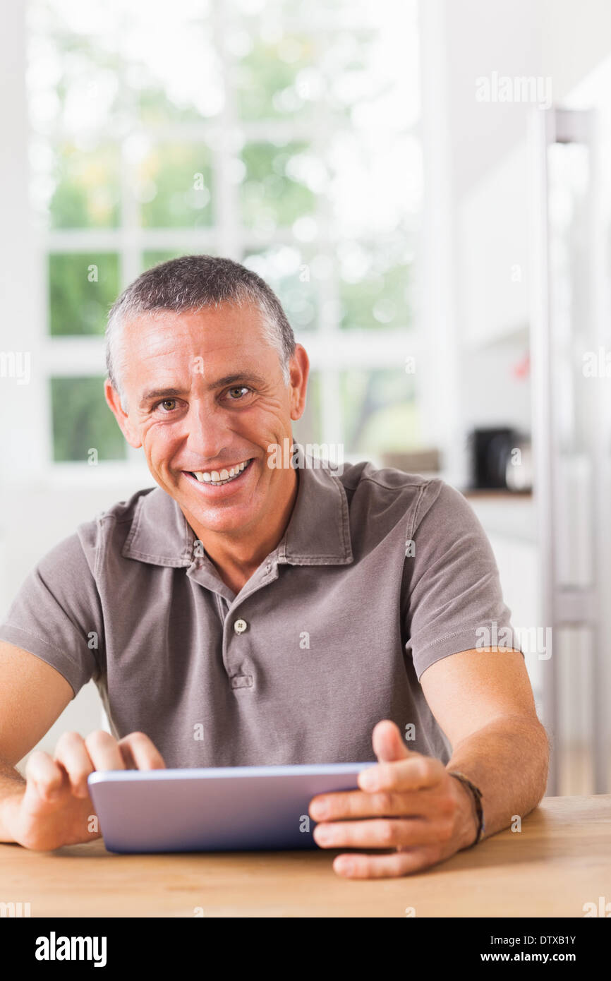 Happy man with tablet Stock Photo - Alamy