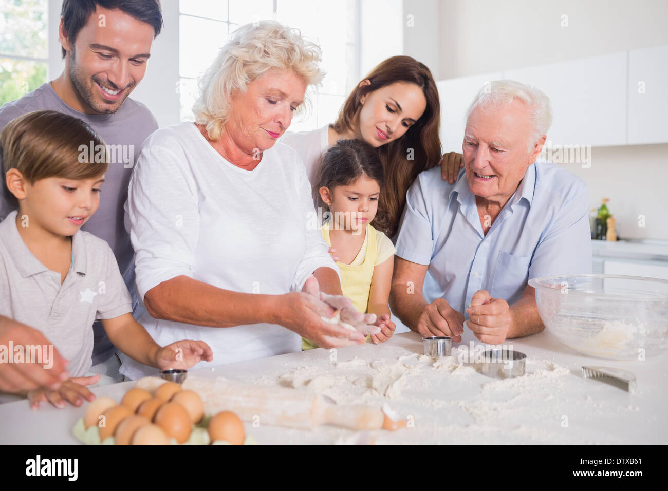 Happy family baking together Stock Photo - Alamy