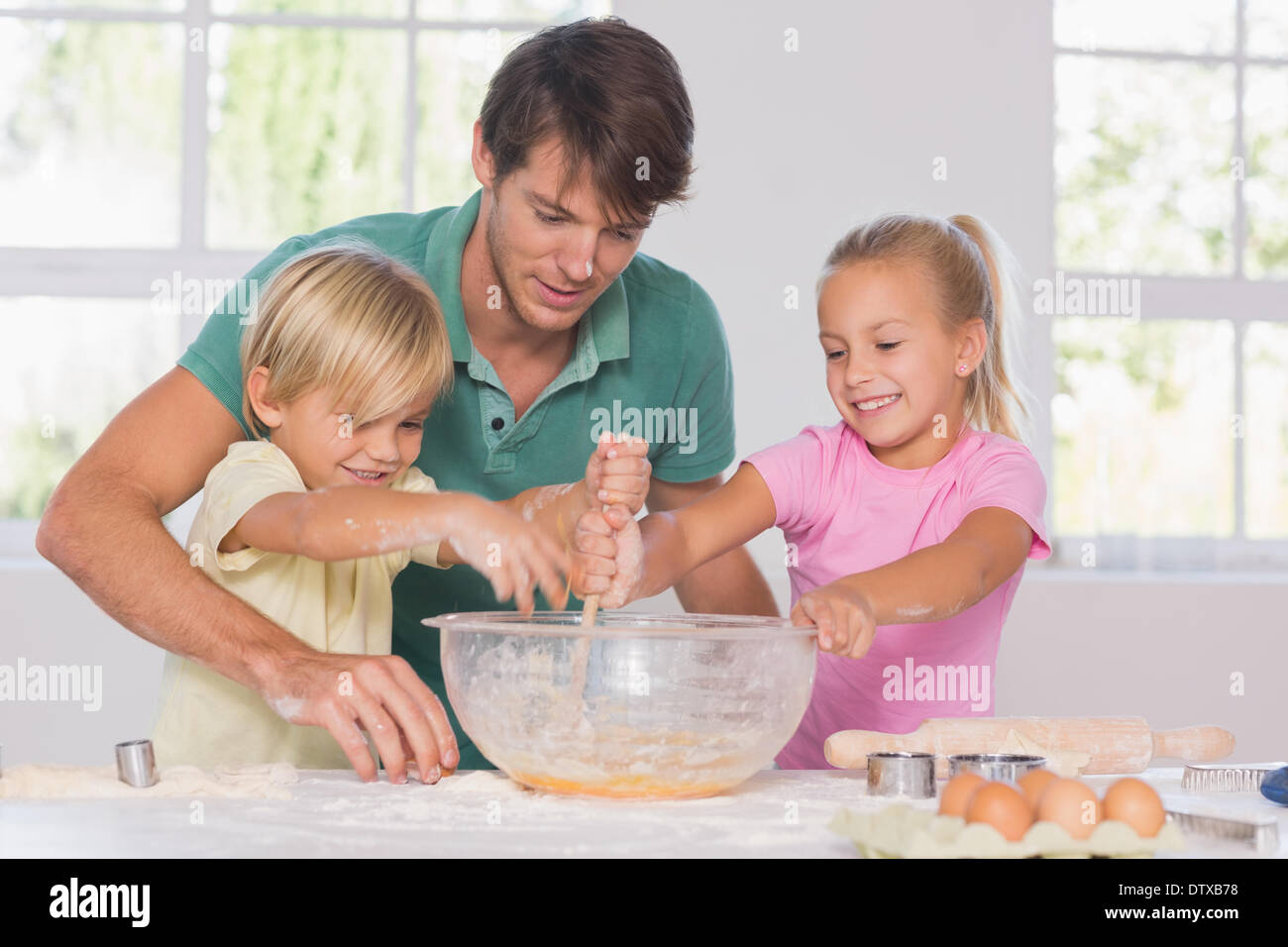 Children mixing the dough Stock Photo - Alamy