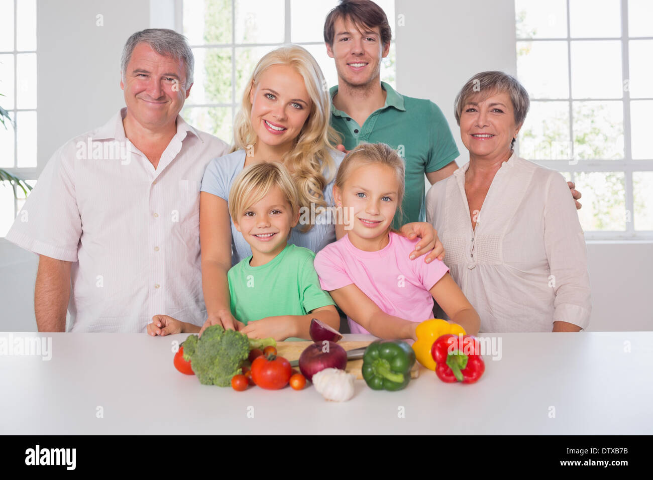 Family smiling with vegetables Stock Photo - Alamy