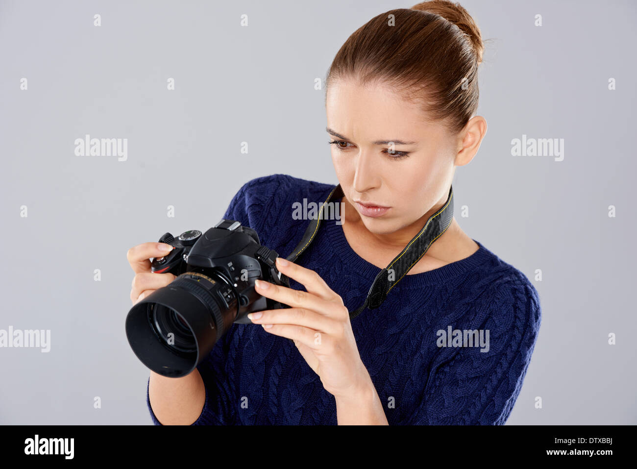 Female photographer checking an image Stock Photo - Alamy