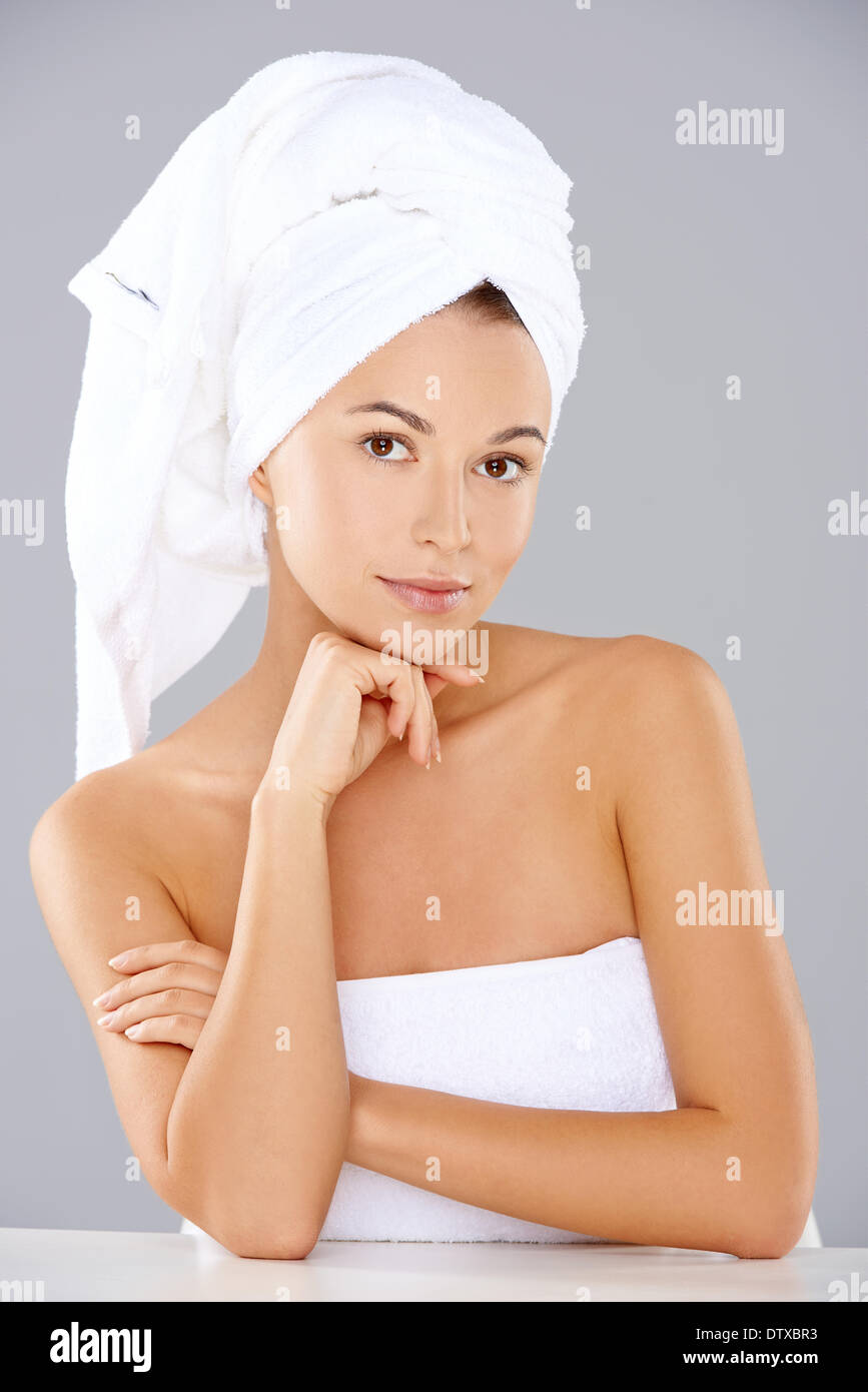 Beautiful serene woman wearing white towels Stock Photo - Alamy