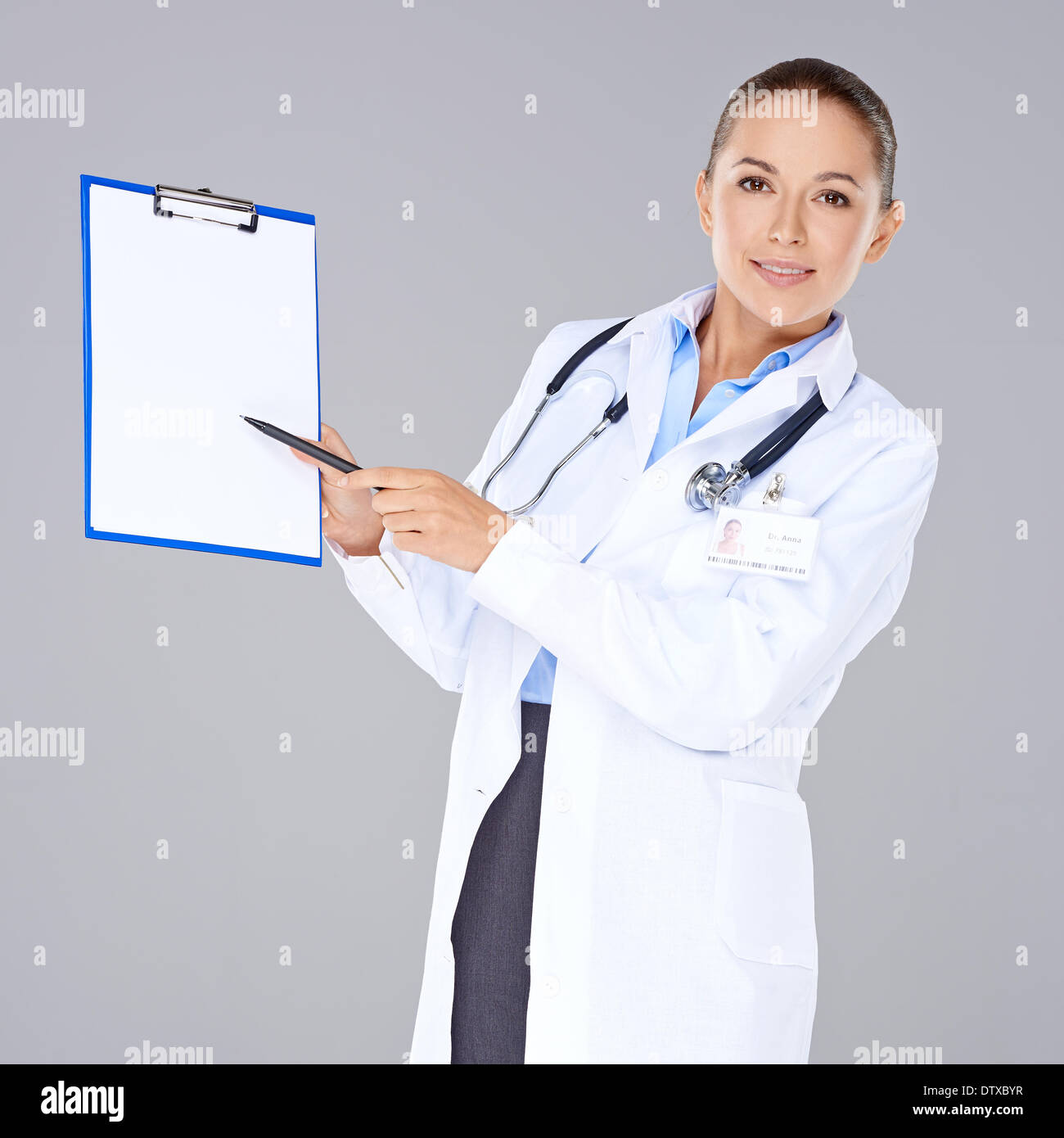 Female doctor displaying a blank clipboard Stock Photo - Alamy