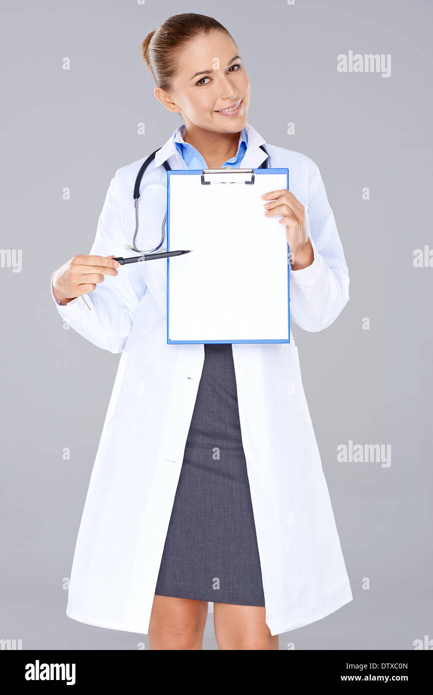 Female doctor displaying a blank clipboard Stock Photo - Alamy