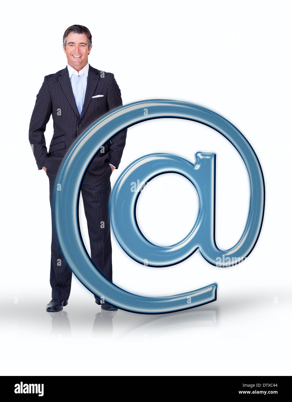Businessman standing with email at symbol Stock Photo - Alamy