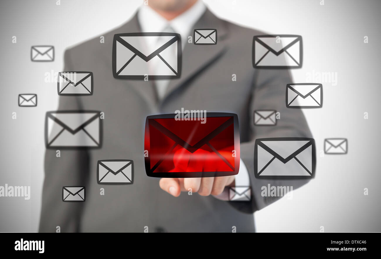 Man selecting red message symbol Stock Photo - Alamy