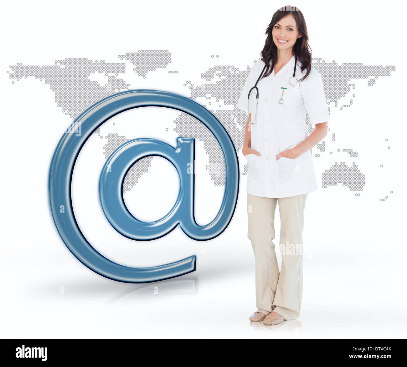 Nurse standing by digital email at symbol Stock Photo - Alamy