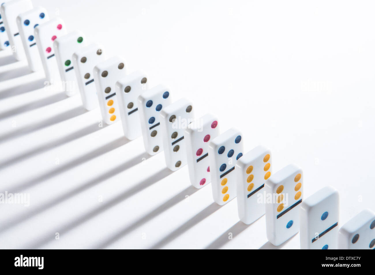 Line of colourful dominoes Stock Photo - Alamy