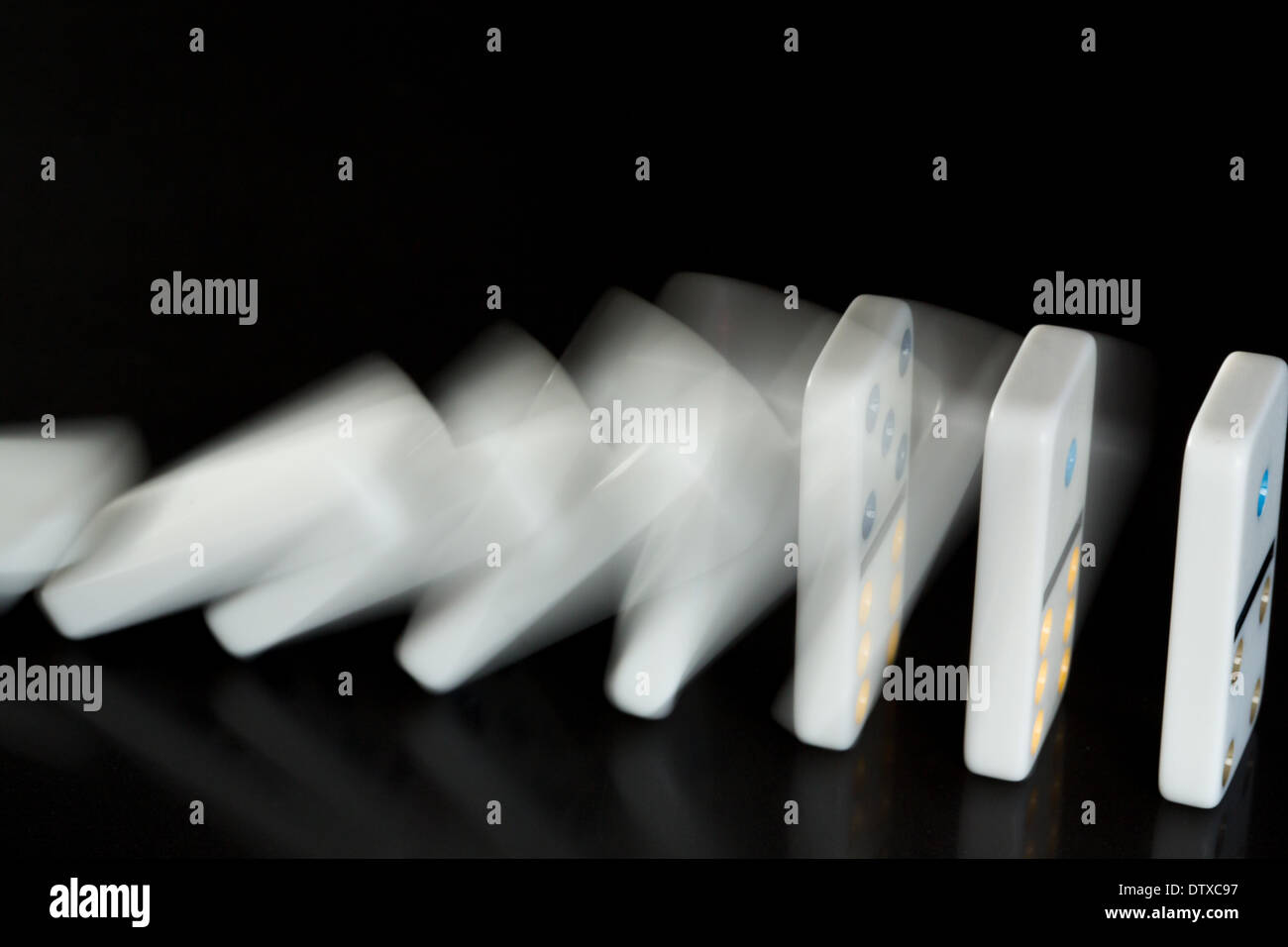 Domino toppling hi-res stock photography and images - Alamy
