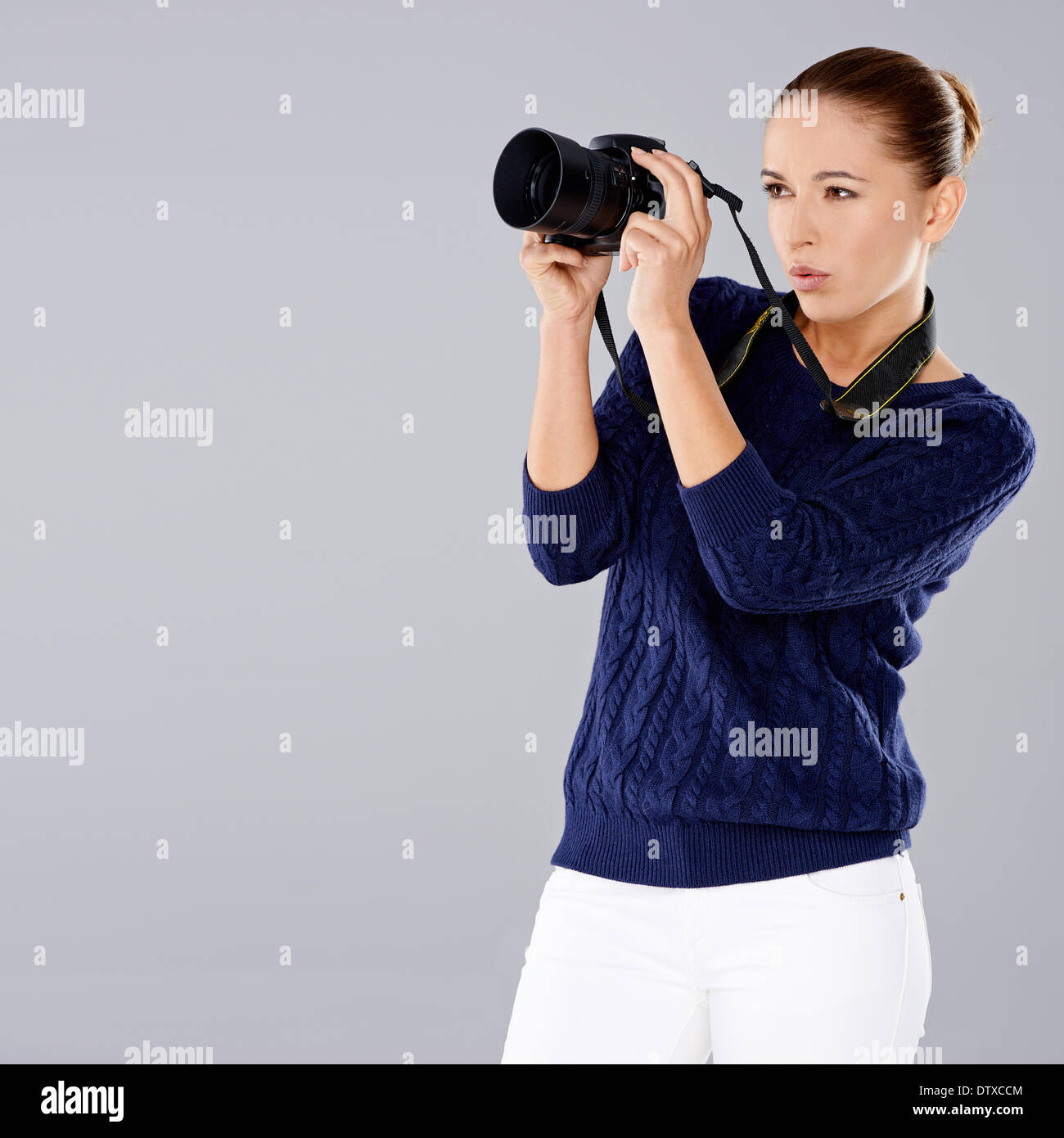 Female photographer assessing her shot Stock Photo - Alamy
