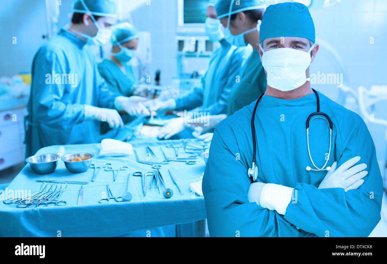 Surgeon standing with arms crossed Stock Photo - Alamy