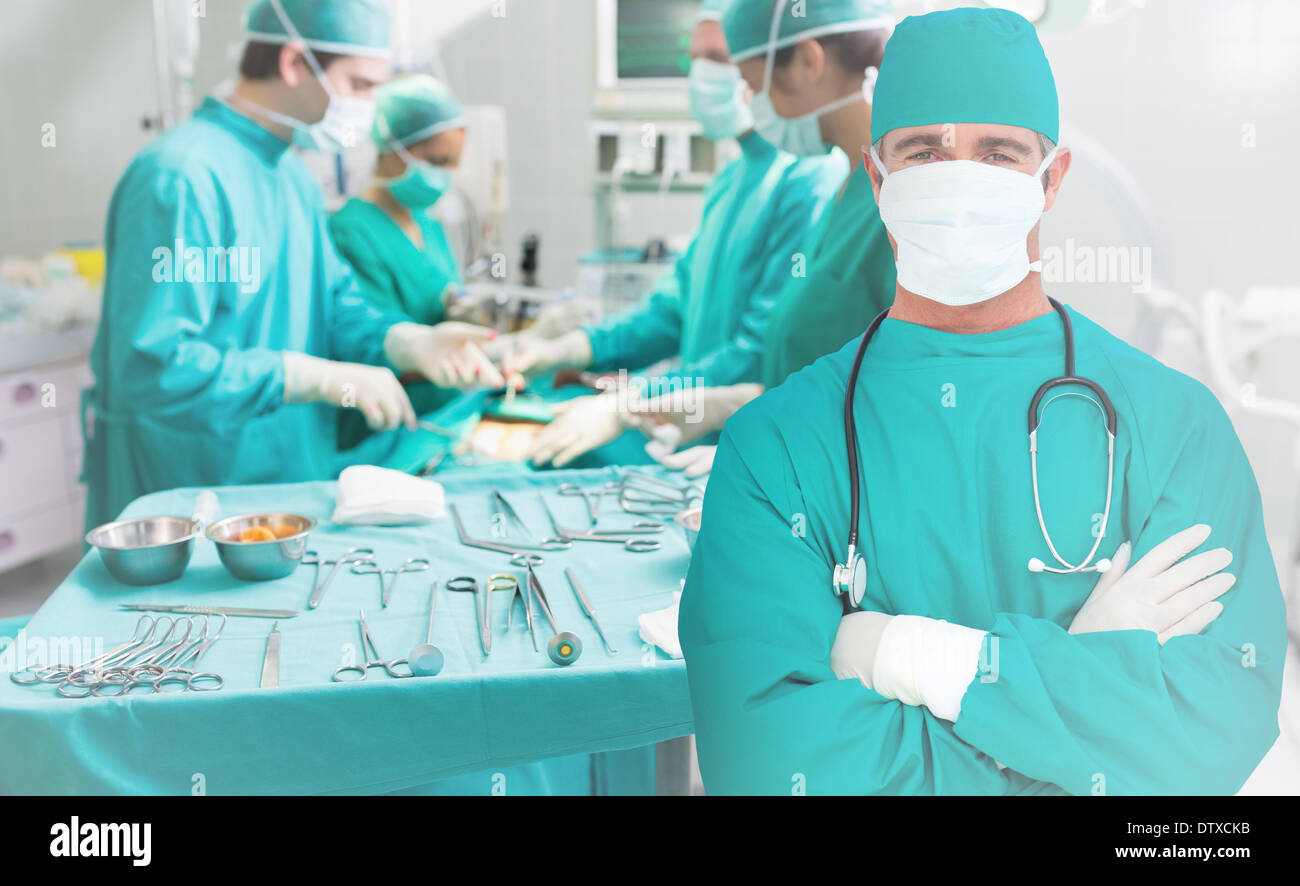 Surgeon standing with his arms crossed Stock Photo - Alamy