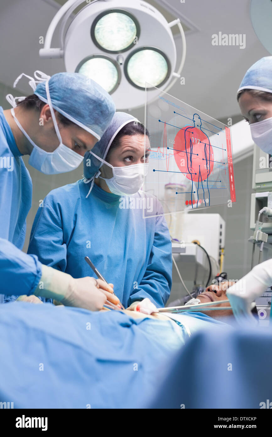 Surgery team using a new technology Stock Photo - Alamy