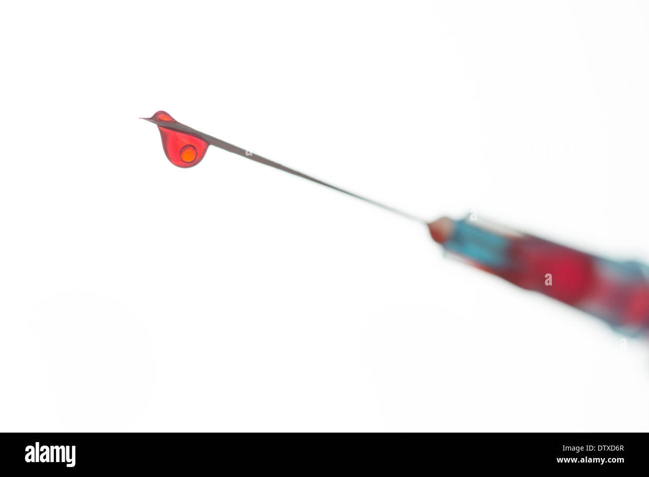 Syringe dripping blood focus shot Stock Photo - Alamy