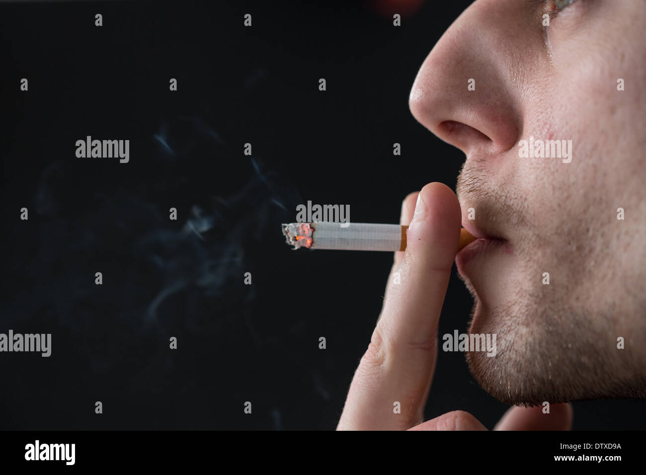 Man smoking cigarette Stock Photo - Alamy