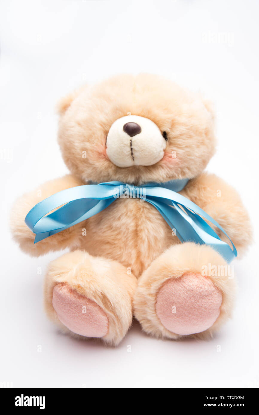 Teddy bear with blue ribbon Stock Photo - Alamy
