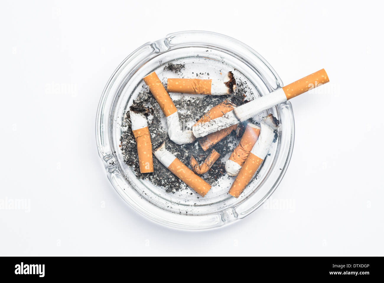 Overhead of burning cigarette in ashtray Stock Photo - Alamy