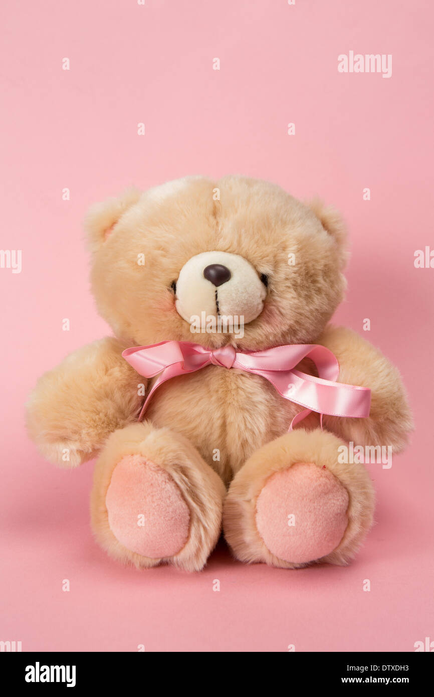 Teddy bear with pink ribbon Stock Photo - Alamy