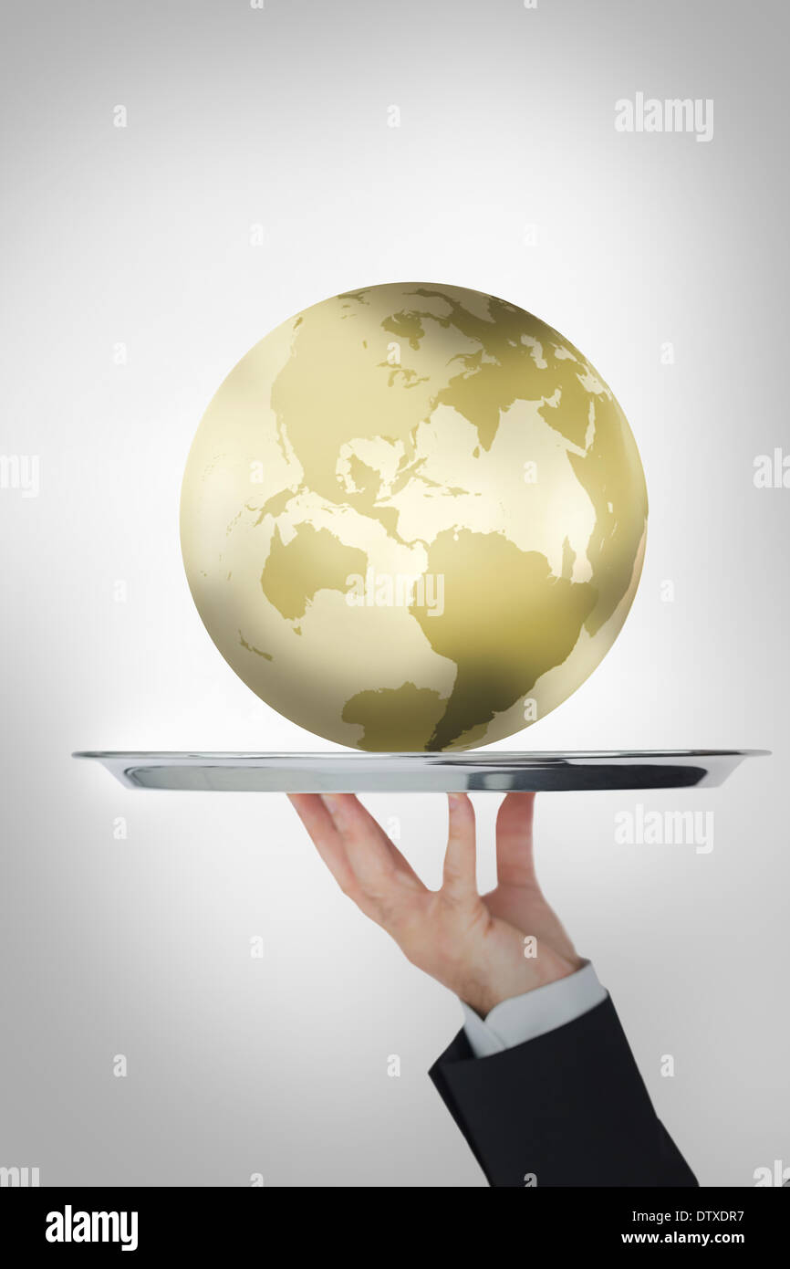 Waiter presenting the world in yellow Stock Photo - Alamy