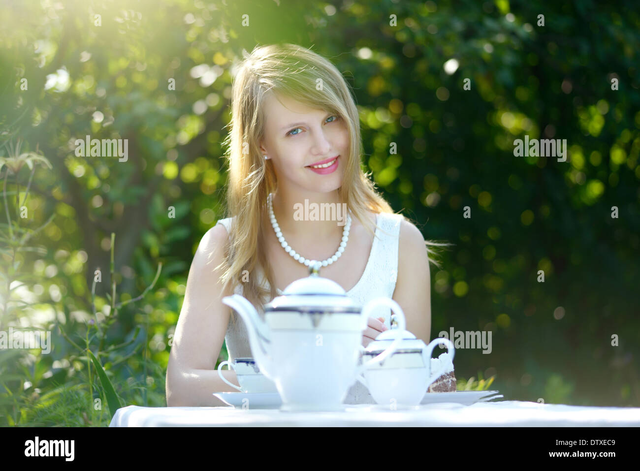 Beautiful woman drinking tea Stock Photo - Alamy