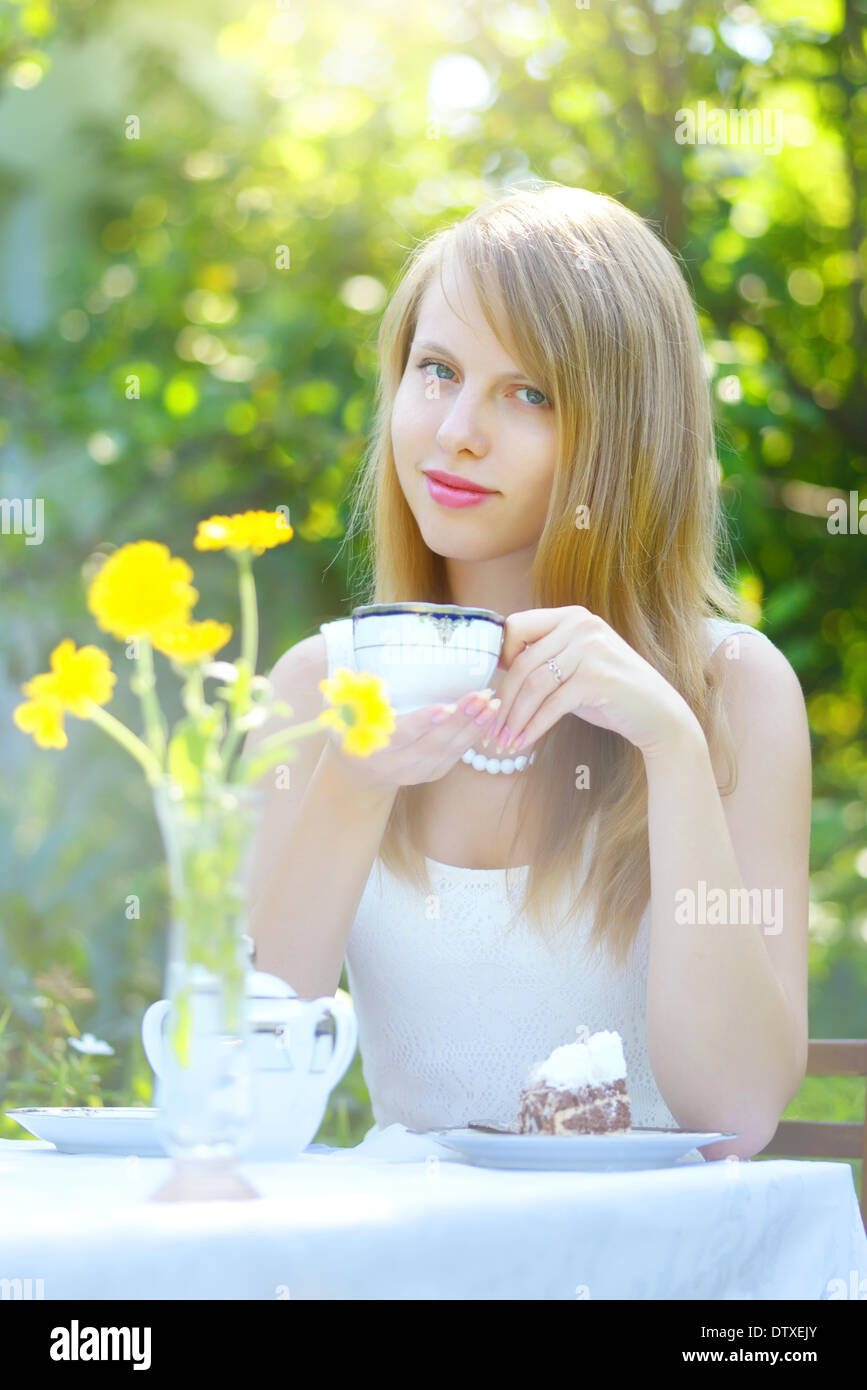 Beautiful woman drinking tea Stock Photo - Alamy