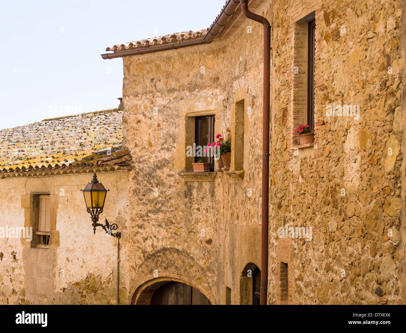 Warm Pals stone with Pots of Flowers. The warm stone facades of the ...