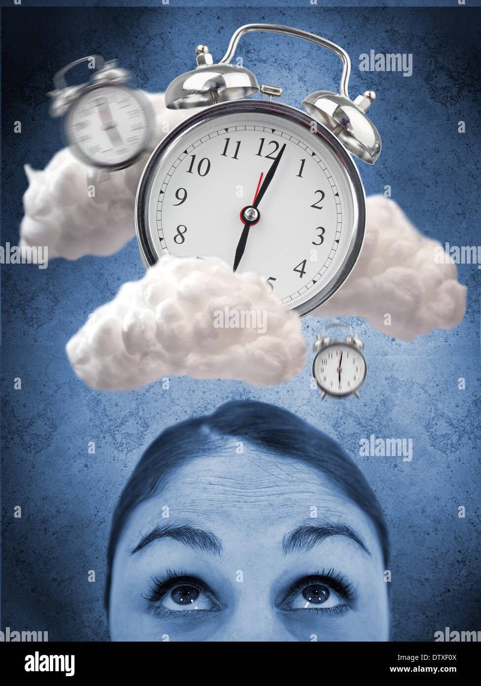 Woman looking up at alarm clock in clouds Stock Photo - Alamy