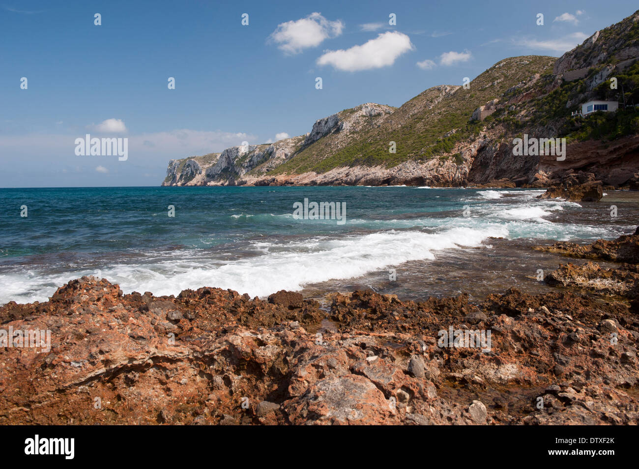 Les Rotes beach, Denia. A rocky coaastline which is a designated area ...