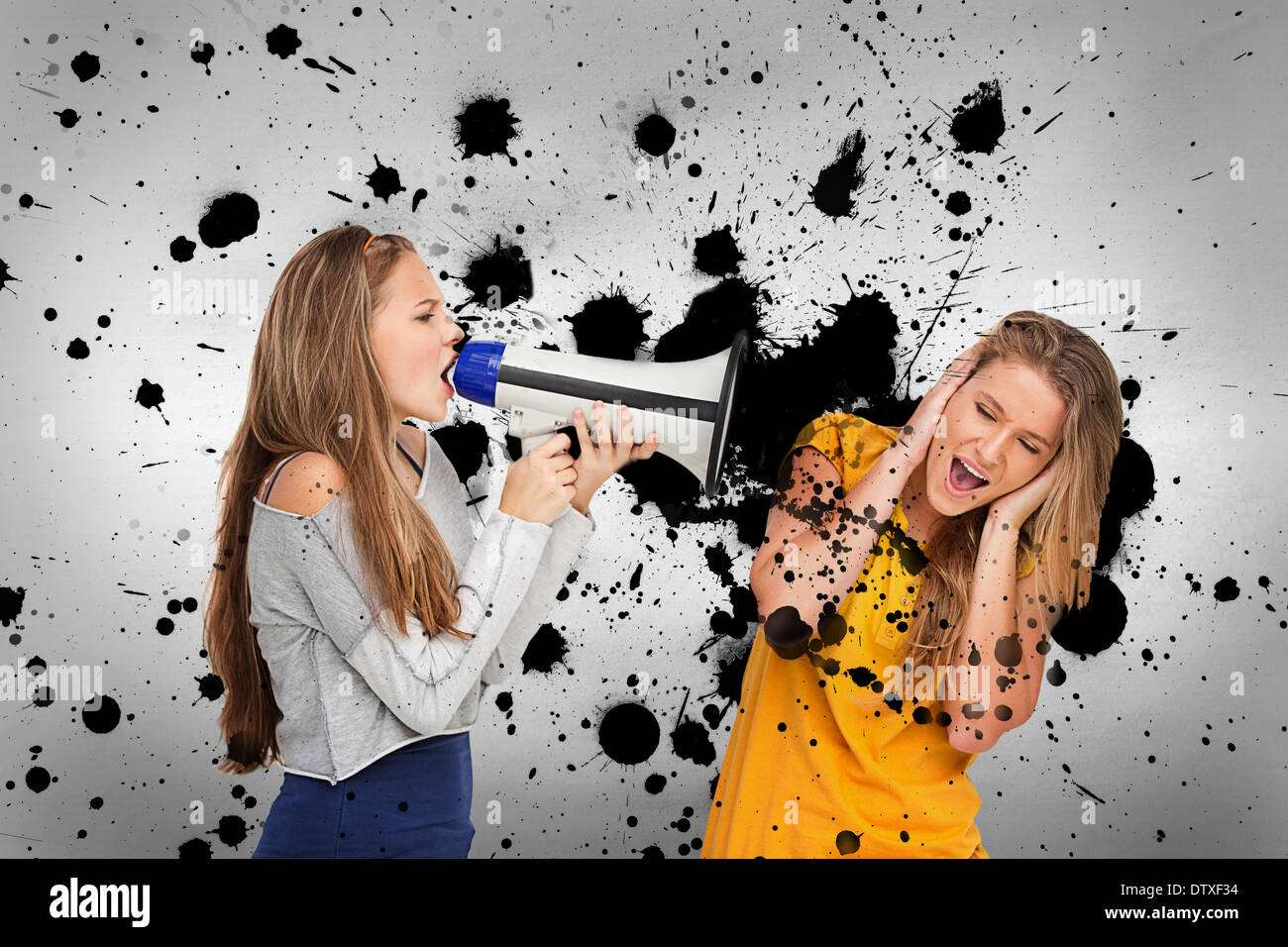Girl shouting at friend through megaphone Stock Photo - Alamy