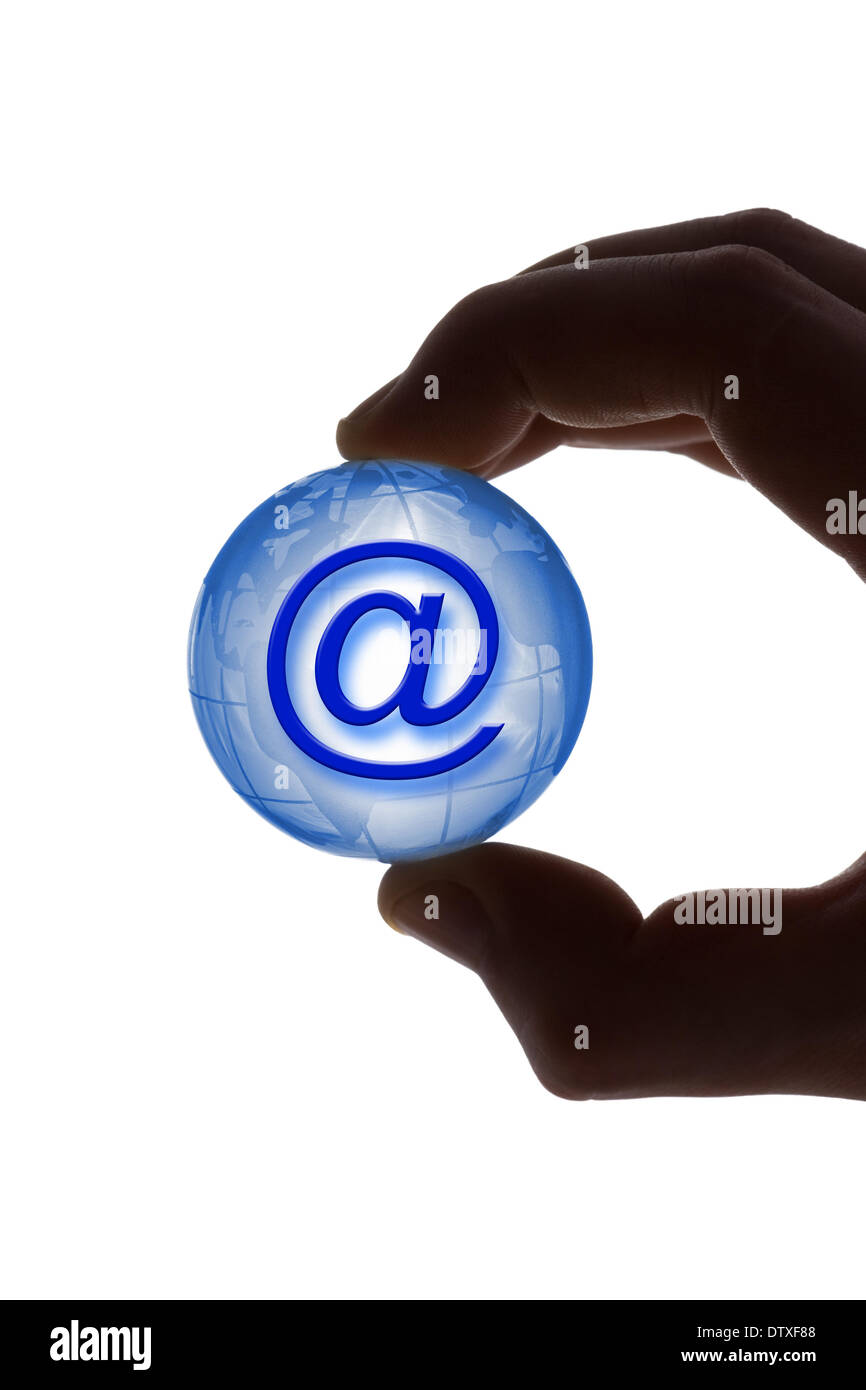 Hand with globe and e-mail symbol Stock Photo - Alamy