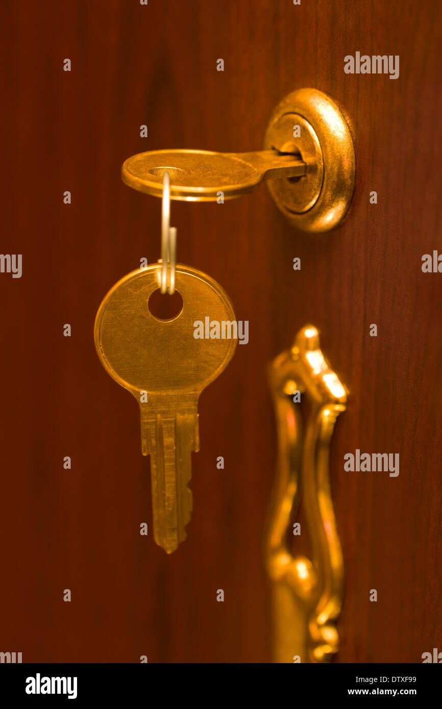 Golden key and lock Stock Photo - Alamy