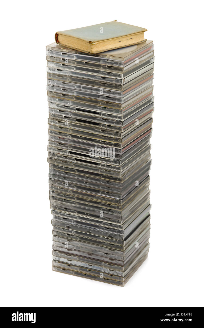 Stack of disks and book Stock Photo - Alamy
