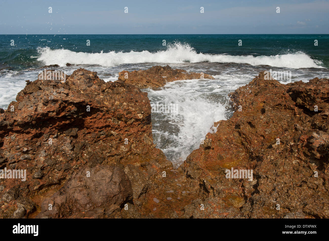 Salt forming on rocks after evaporation of sea water. Spain Stock Photo ...