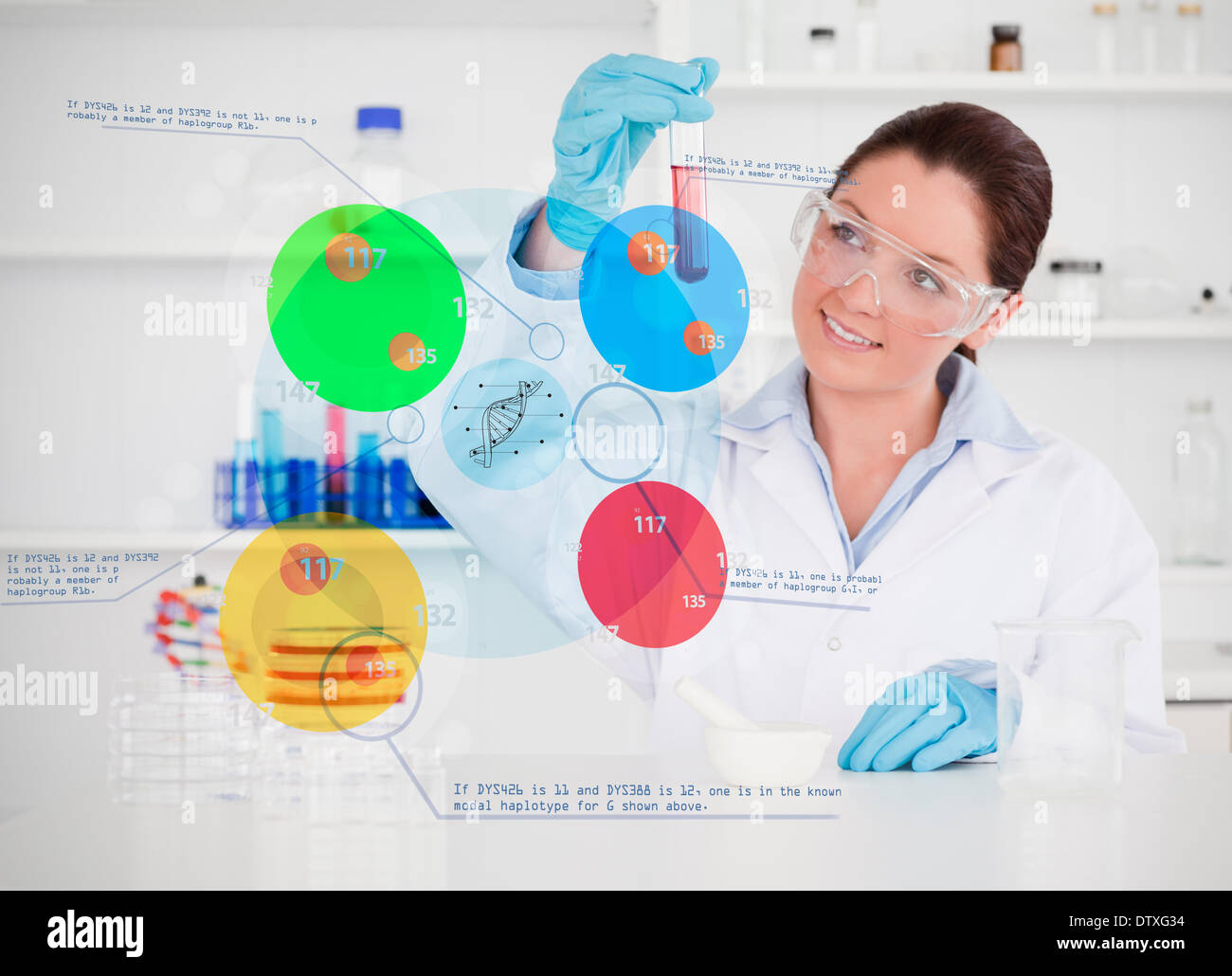 Smiling chemist looking at test tube Stock Photo - Alamy